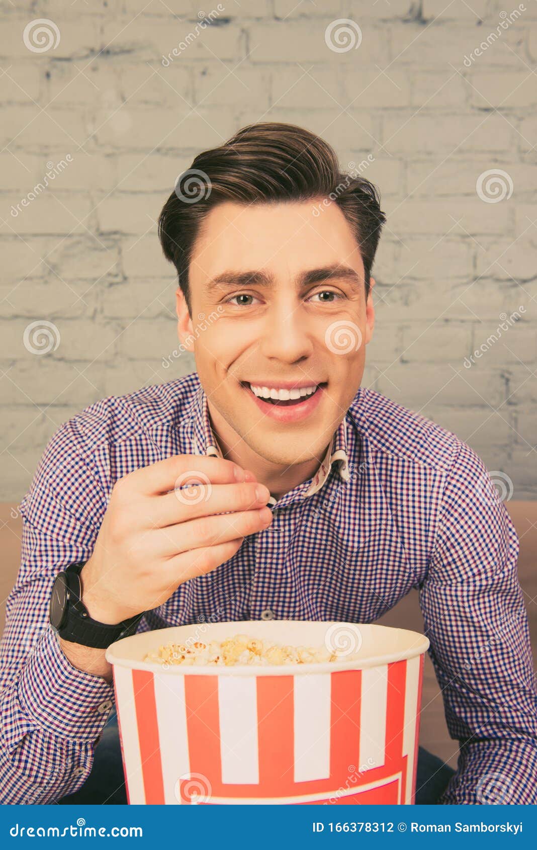Portrait of Happy Smiling Man Eating Popcorn at Home Stock Photo ...