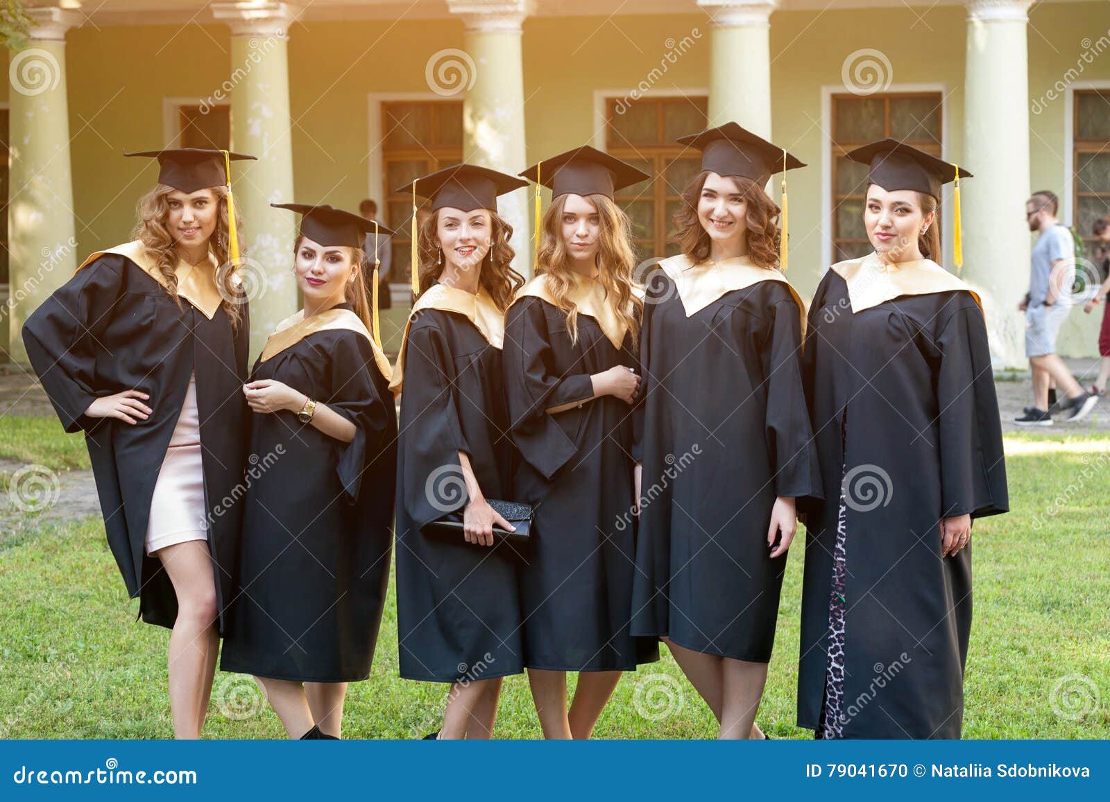 Portrait of Happy Students in Graduation Gowns Stock Photo - Image of ...