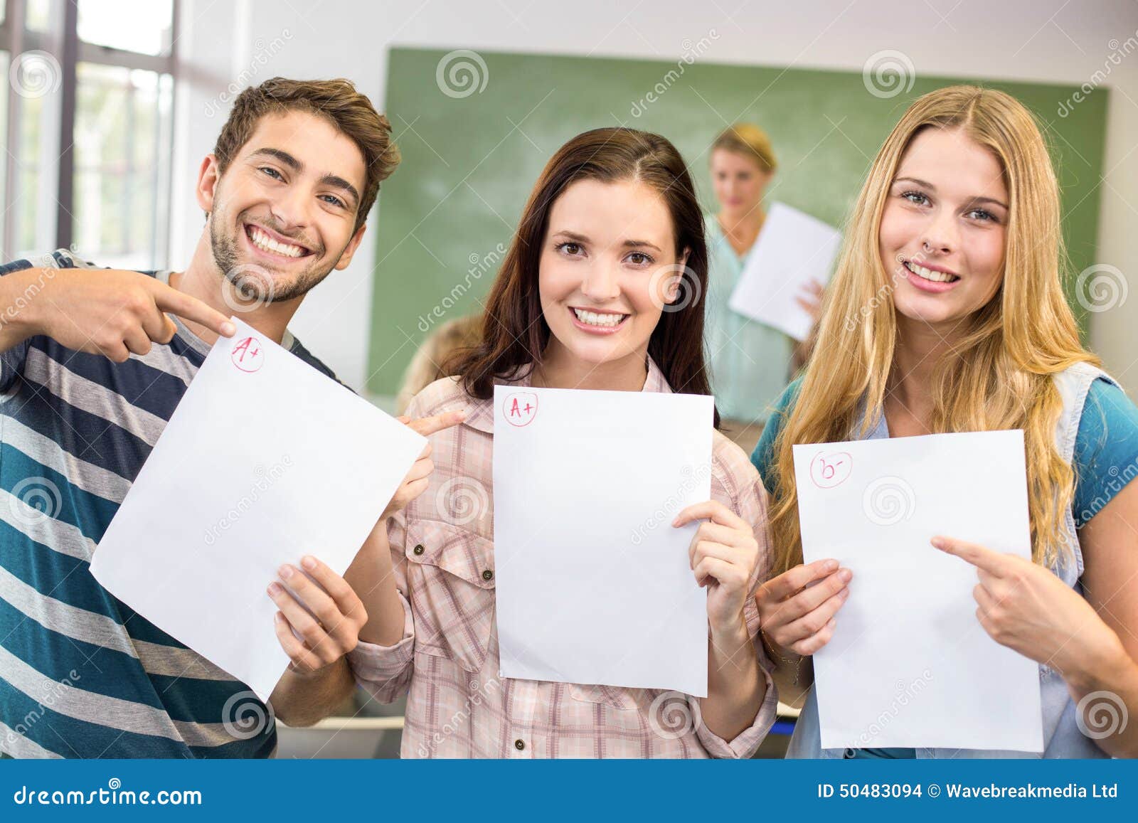 Portrait of Happy Students Pointing at Papers Stock Photo - Image of ...