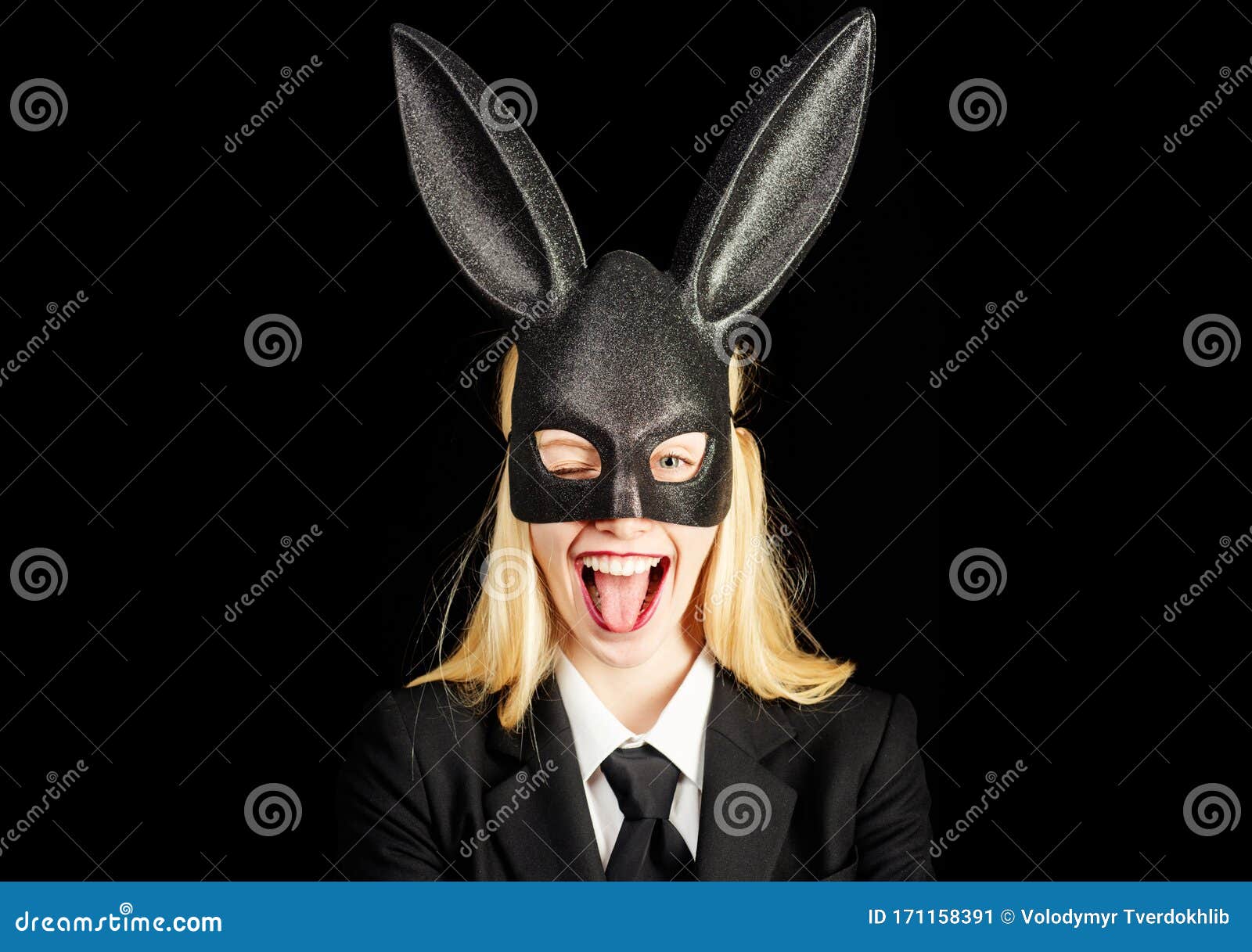 Portrait Of A Happy Woman In Bunny Ears Winking Closeup Of Winking