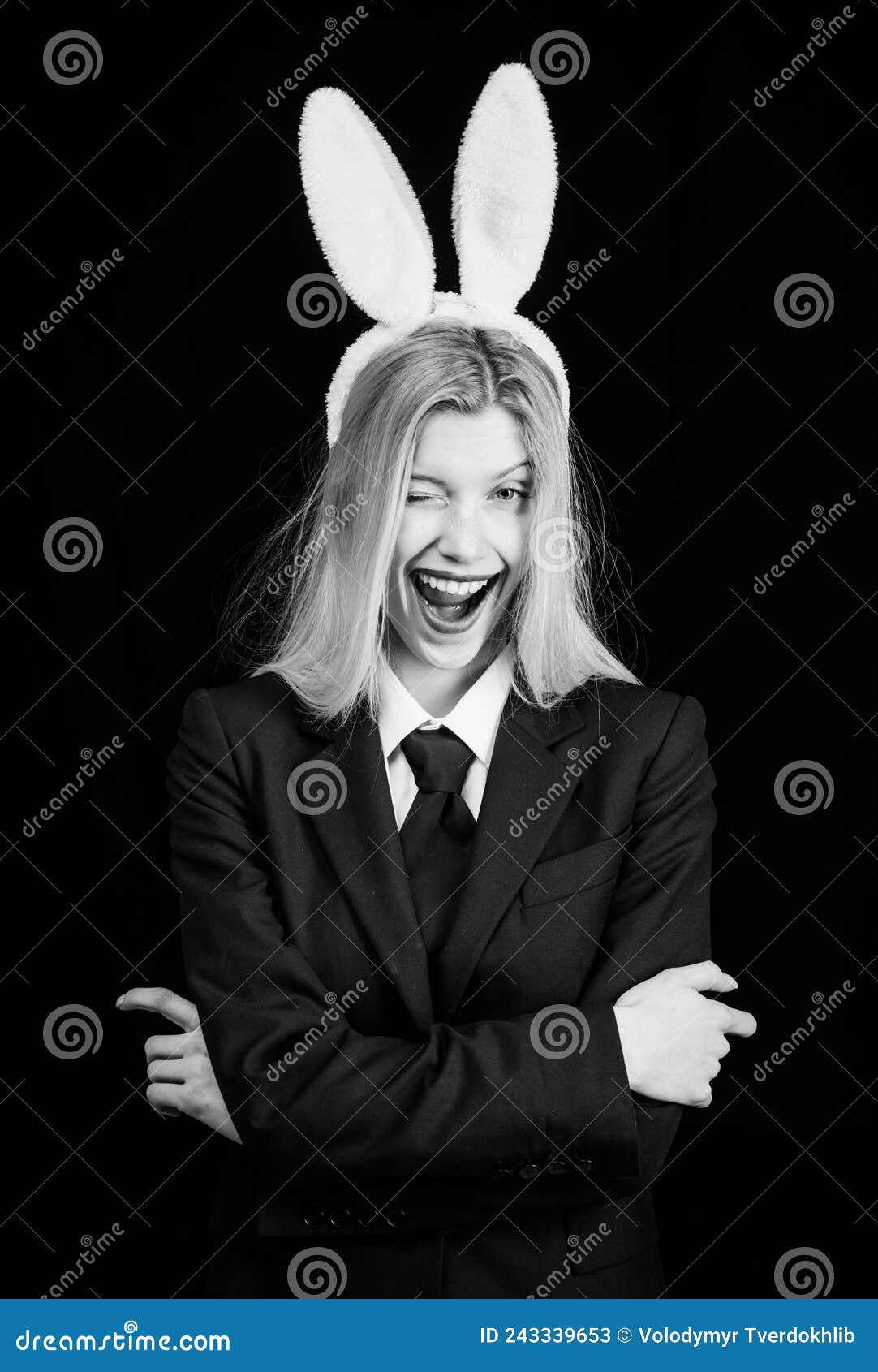 Portrait Of A Happy Woman In Bunny Ears Winking Closeup Of Winking