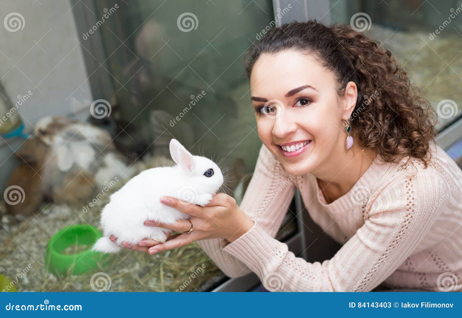 Portrait of Happy Woman Holding Rabbit Stock Image - Image of customer ...