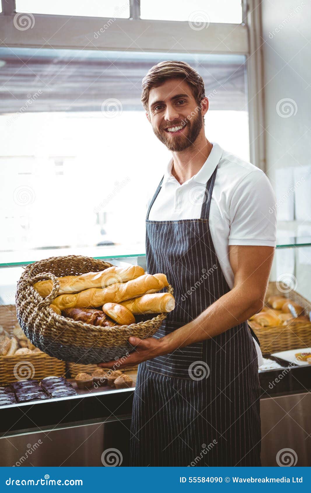 Portrait of Happy Worker Holding Basket of Bread Stock Photo - Image of ...