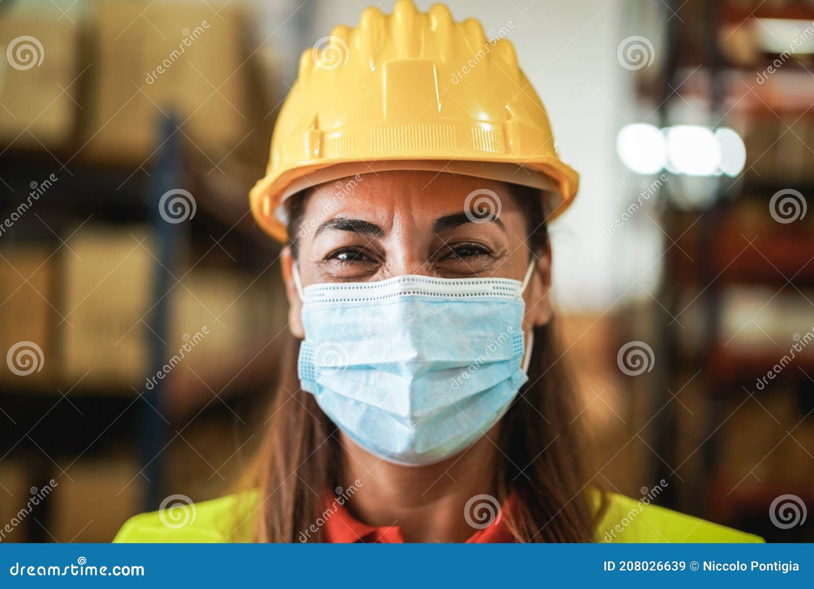 Portrait of Happy Worker Woman Looking at Camera Inside Warehouse while ...