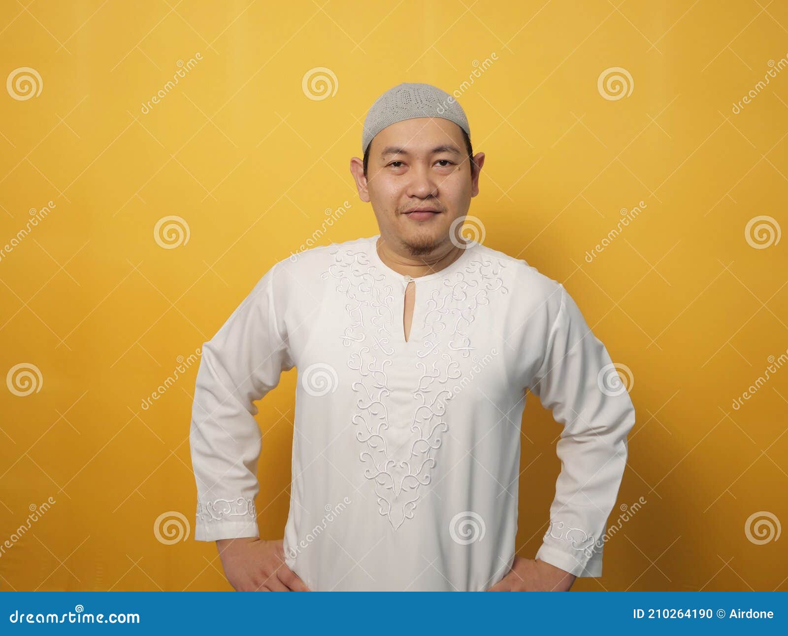 Portrait of Happy Young Asian Muslim Man Smiling and Posing for Camera ... Portrait of Happy Young Asian Muslim Man Smiling and Posing for Camera ...