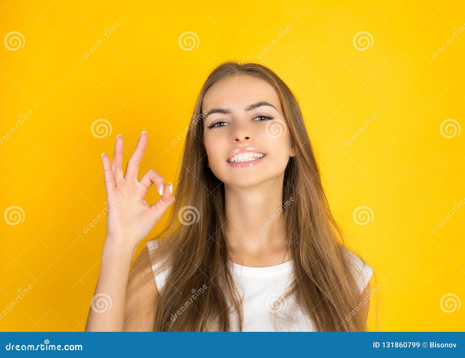 Portrait Of A Happy Young Blonde Girl Showing Ok Gesture Stock Image