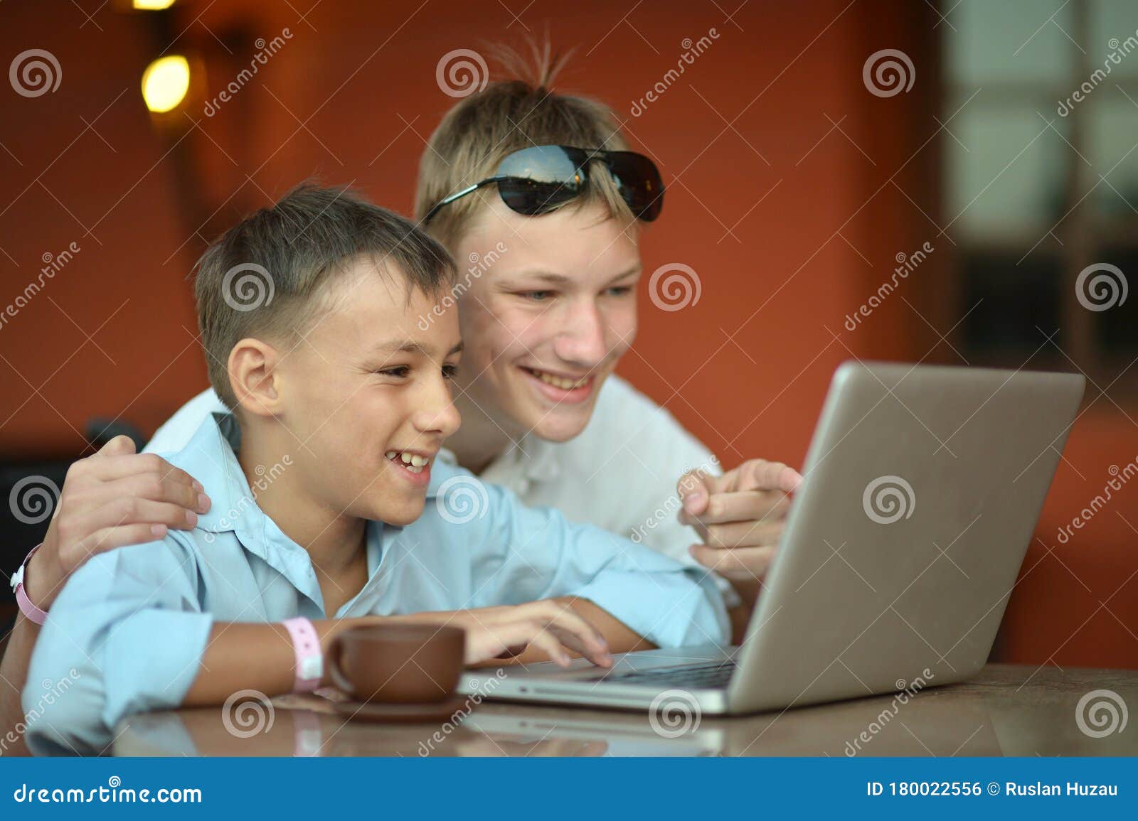 Portrait of Happy Young Boys Using Laptop Computer Stock Photo - Image ...