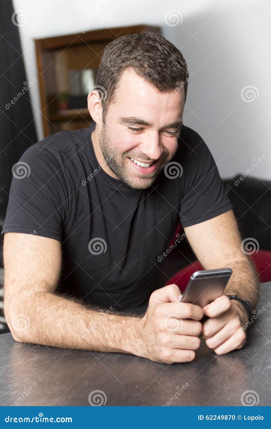 Portrait of Happy Young Man at Home Stock Photo - Image of phone ...