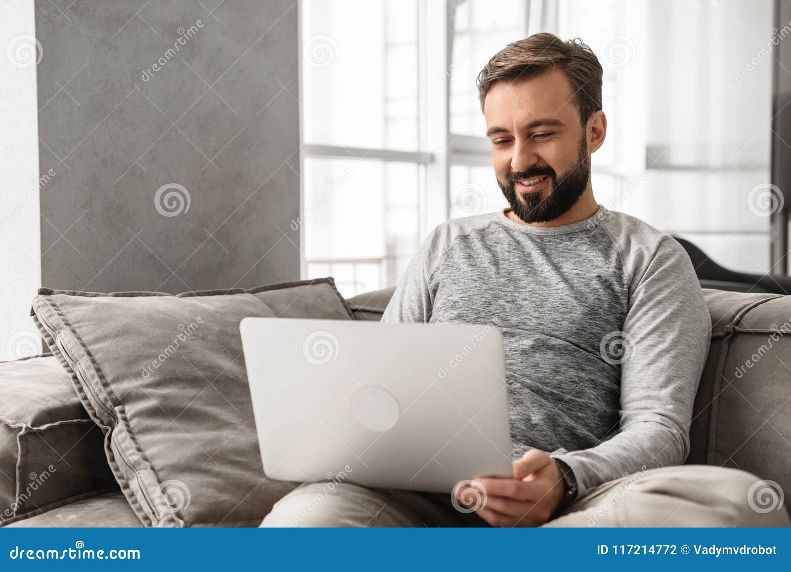 Portrait of a Happy Young Man Working on Laptop Computer Stock Photo ... Portrait of a Happy Young Man Working on Laptop Computer Stock Photo ...