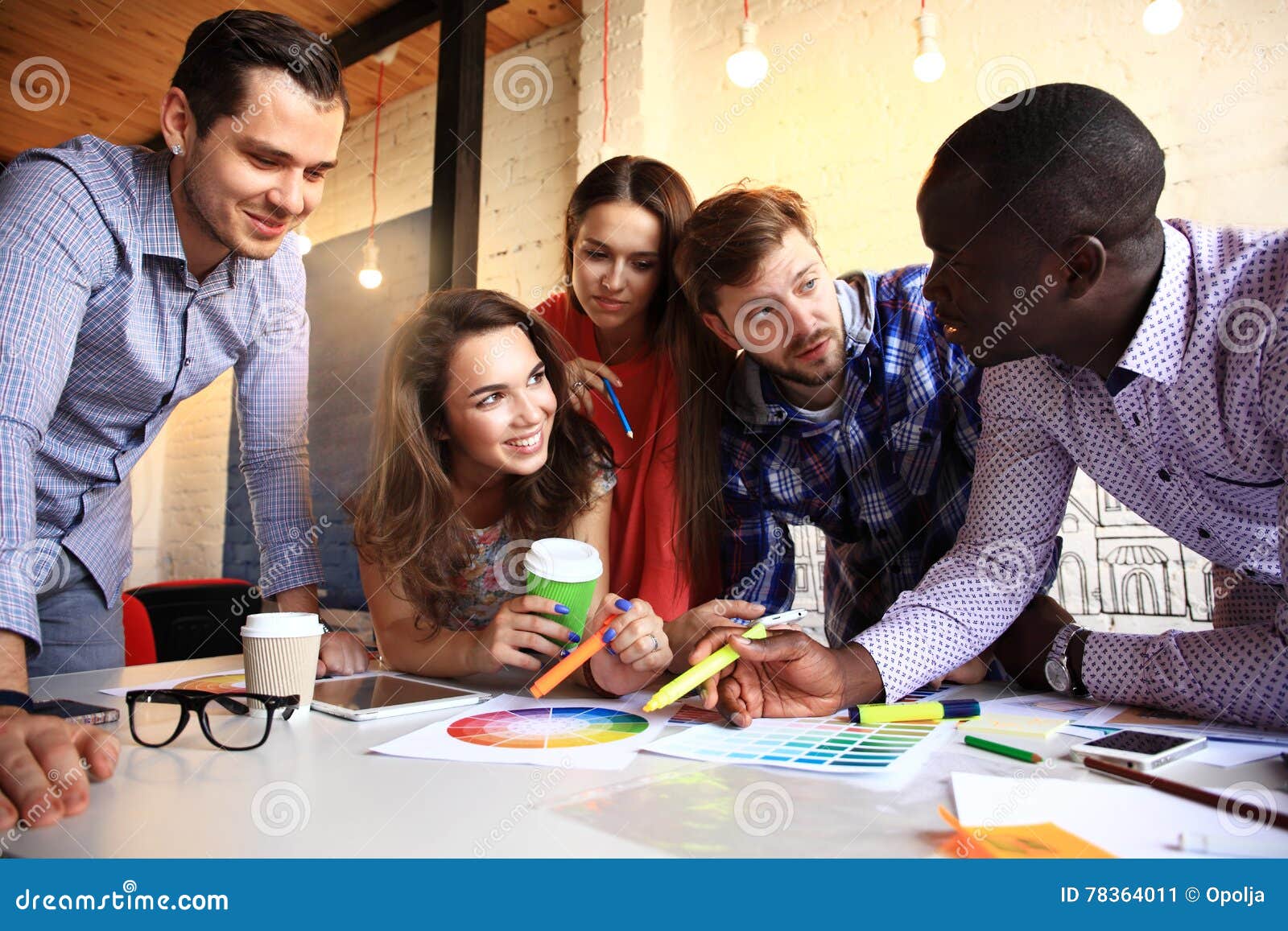 Portrait of Happy Young People in a Meeting Looking at Camera and ... Portrait of Happy Young People in a Meeting Looking at Camera and ...