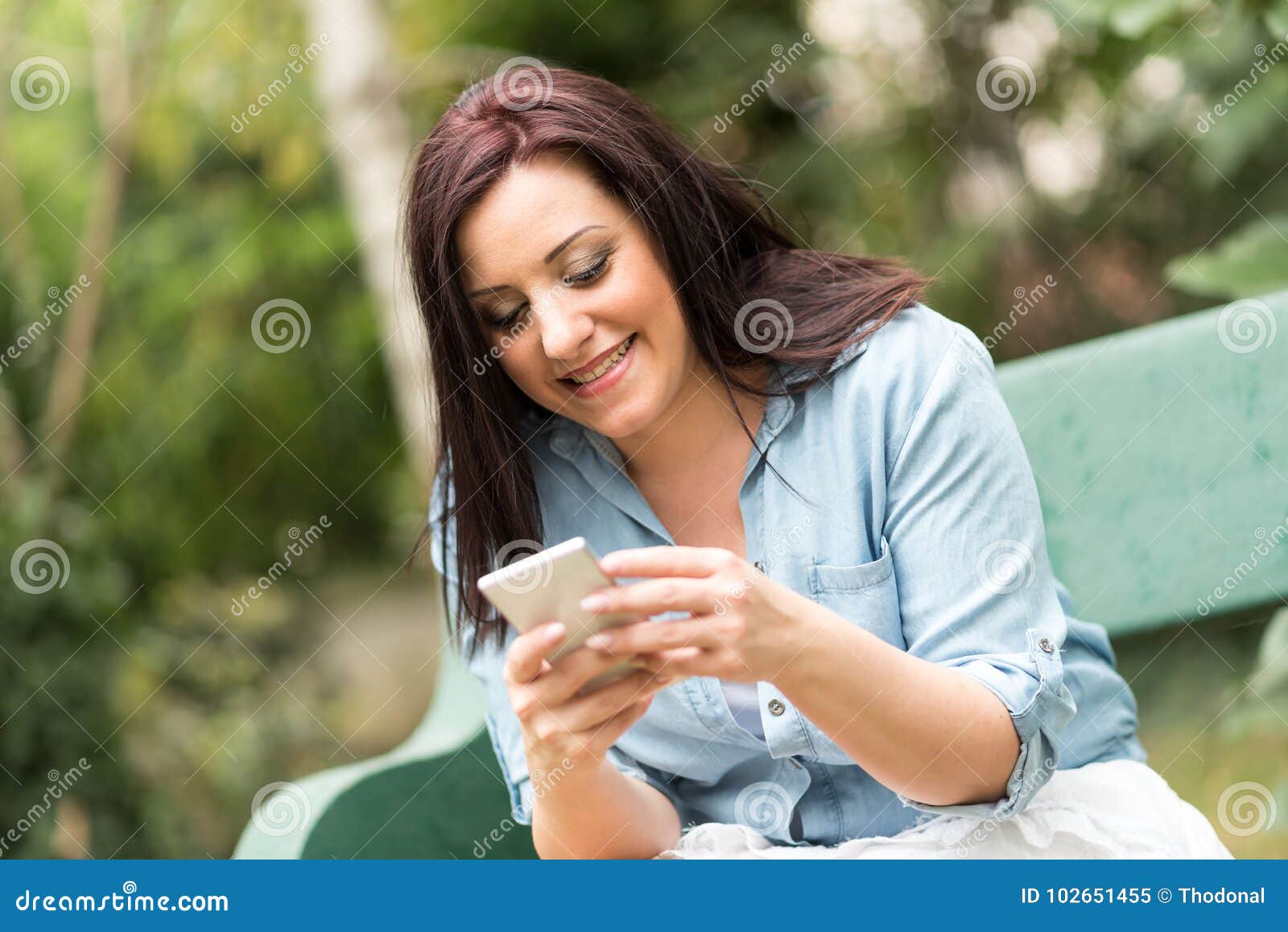 Portrait of Happy Young Woman Using Her Mobile Phone Stock Image ...