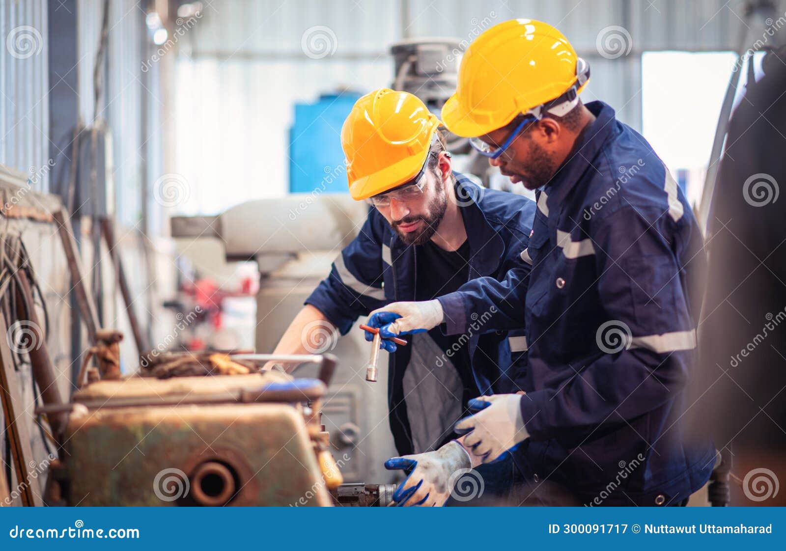 Portrait of Heavy Industry Workers Working on the Metal Fabrication ...