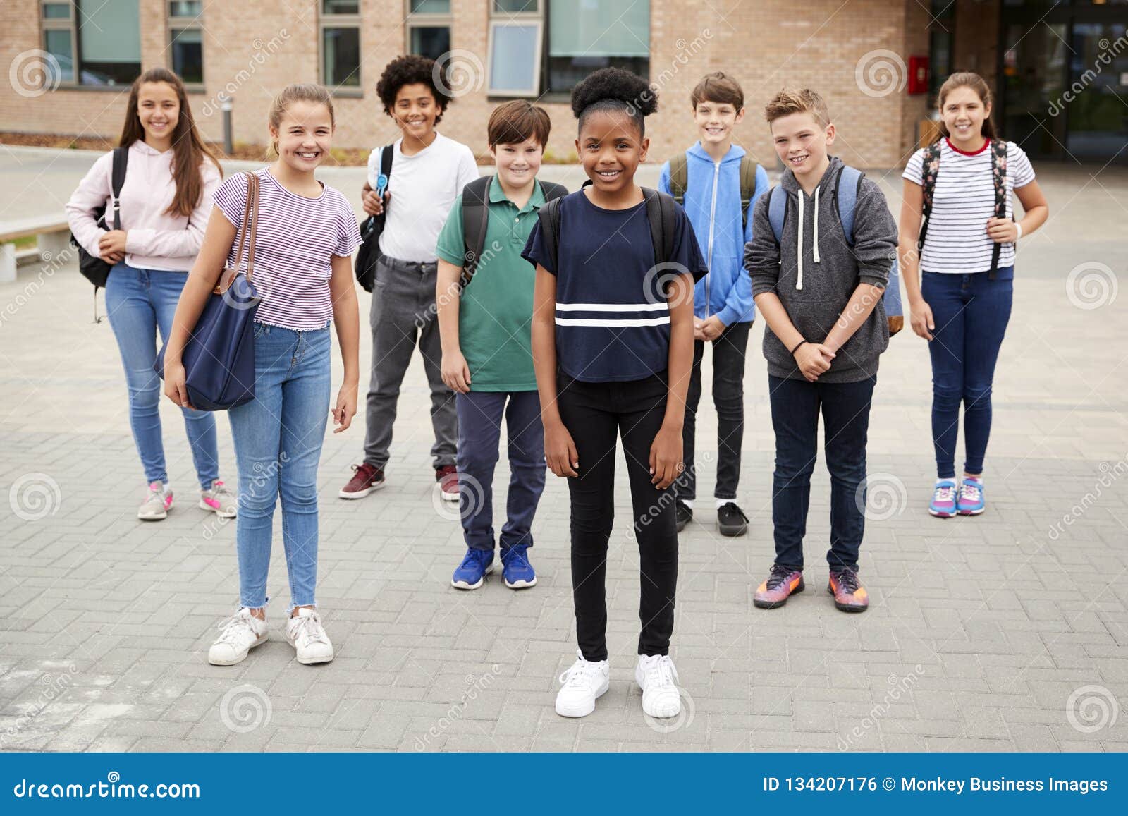 Portrait of High School Student Group Standing Outside School Buildings ...