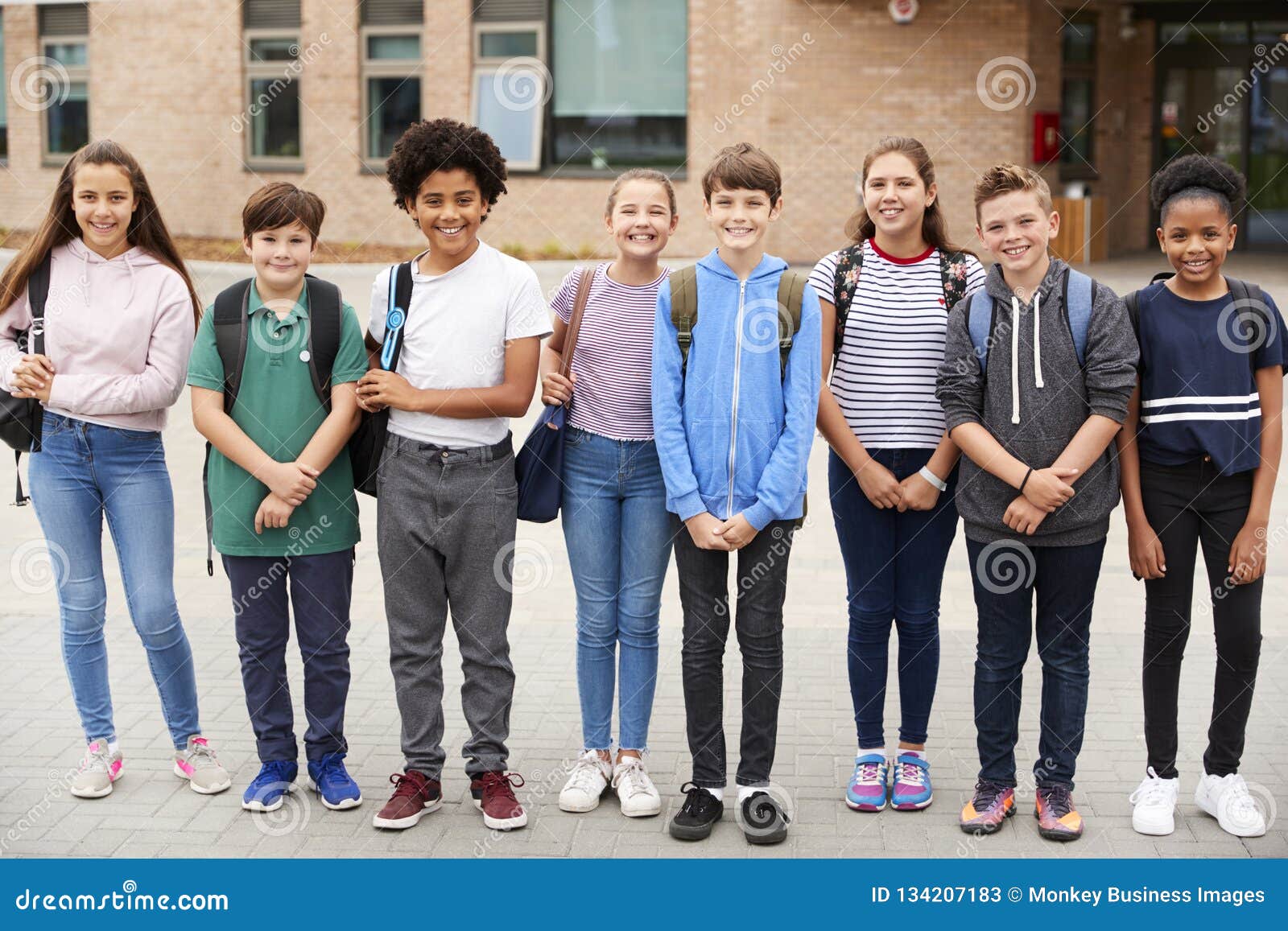Portrait of High School Student Group Standing Outside School Buildings ...