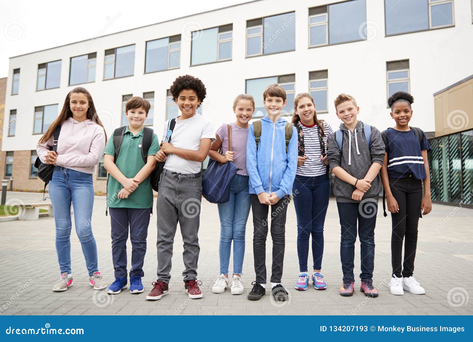 Portrait of High School Student Group Standing Outside School Buildings ...
