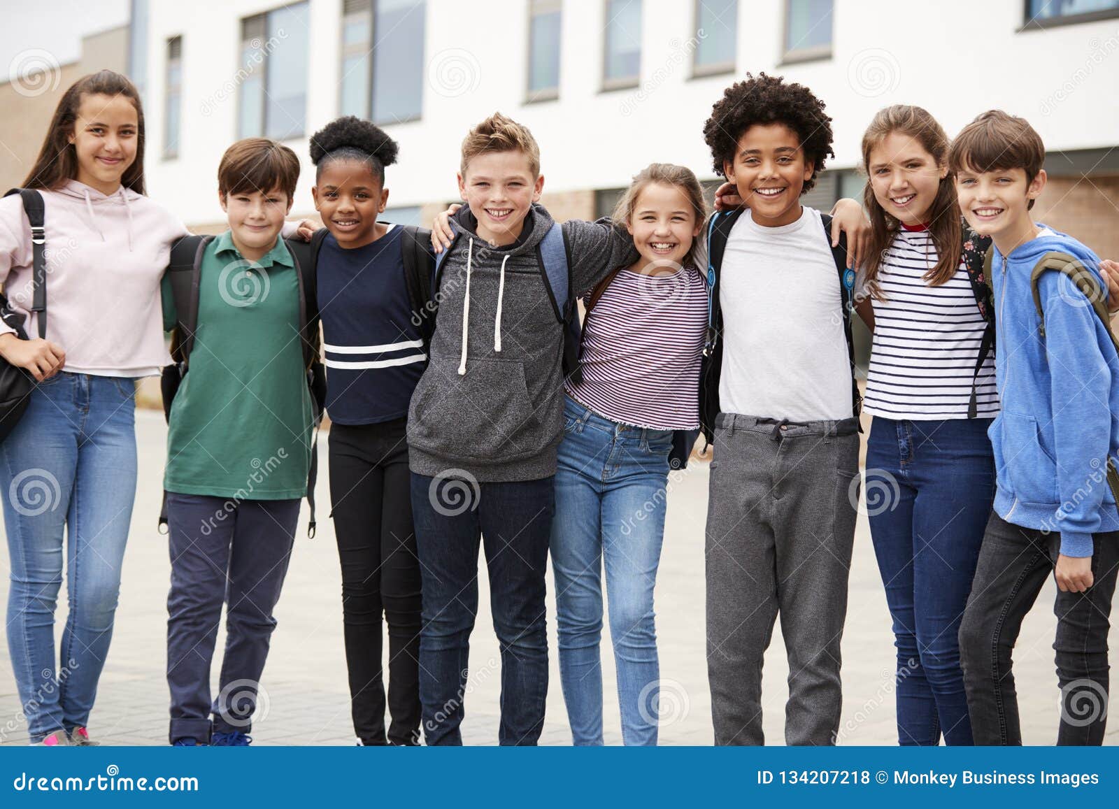 Portrait of High School Student Group Standing Outside School Buildings ...