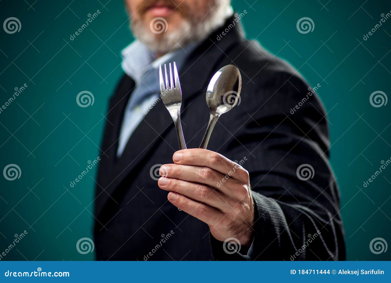 A Portrait of Hungry Man in Suit Holding Spoon and Fork Stock Photo ...