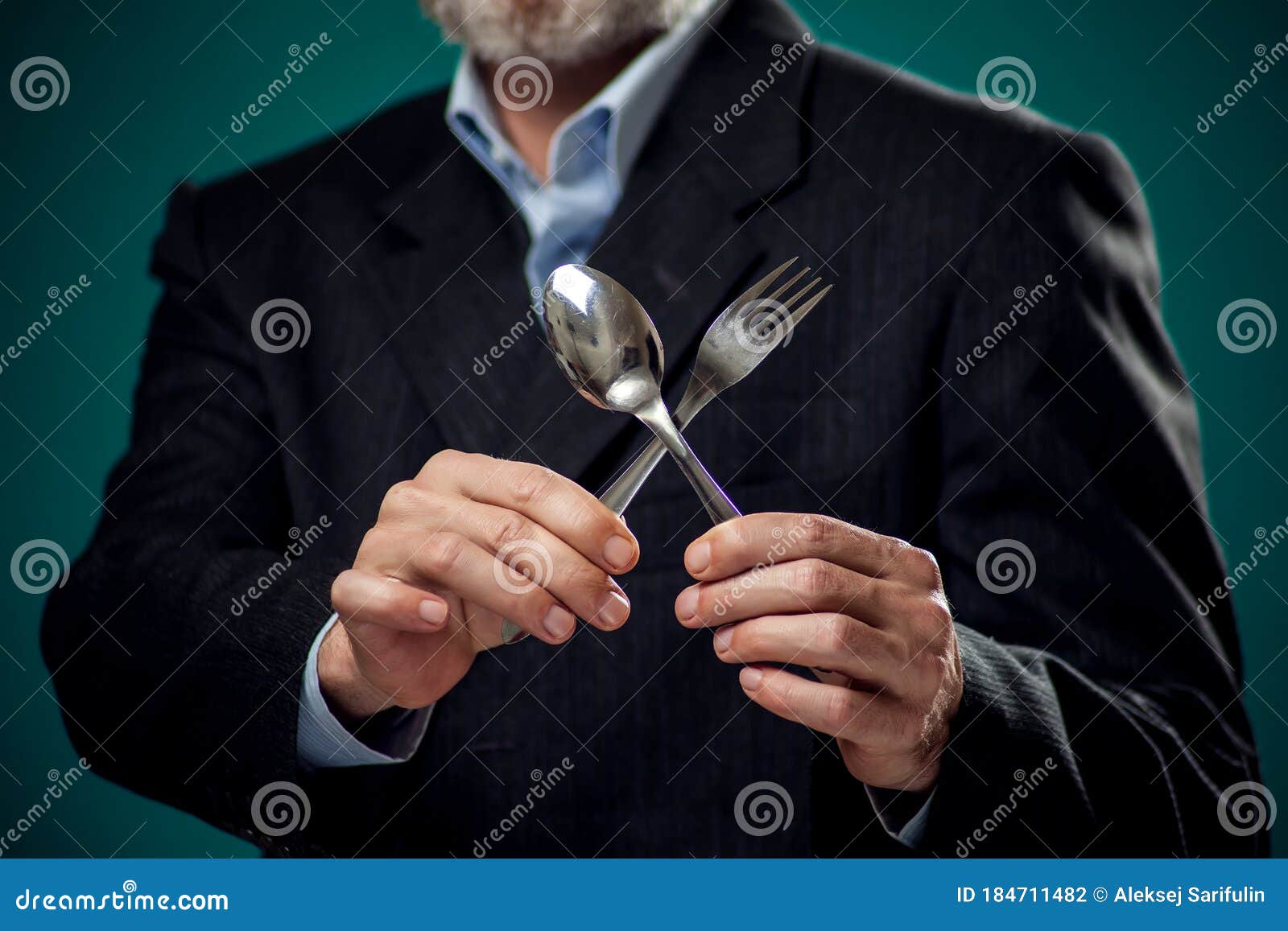 A Portrait of Hungry Man in Suit Holding Spoon and Fork Stock Photo ...