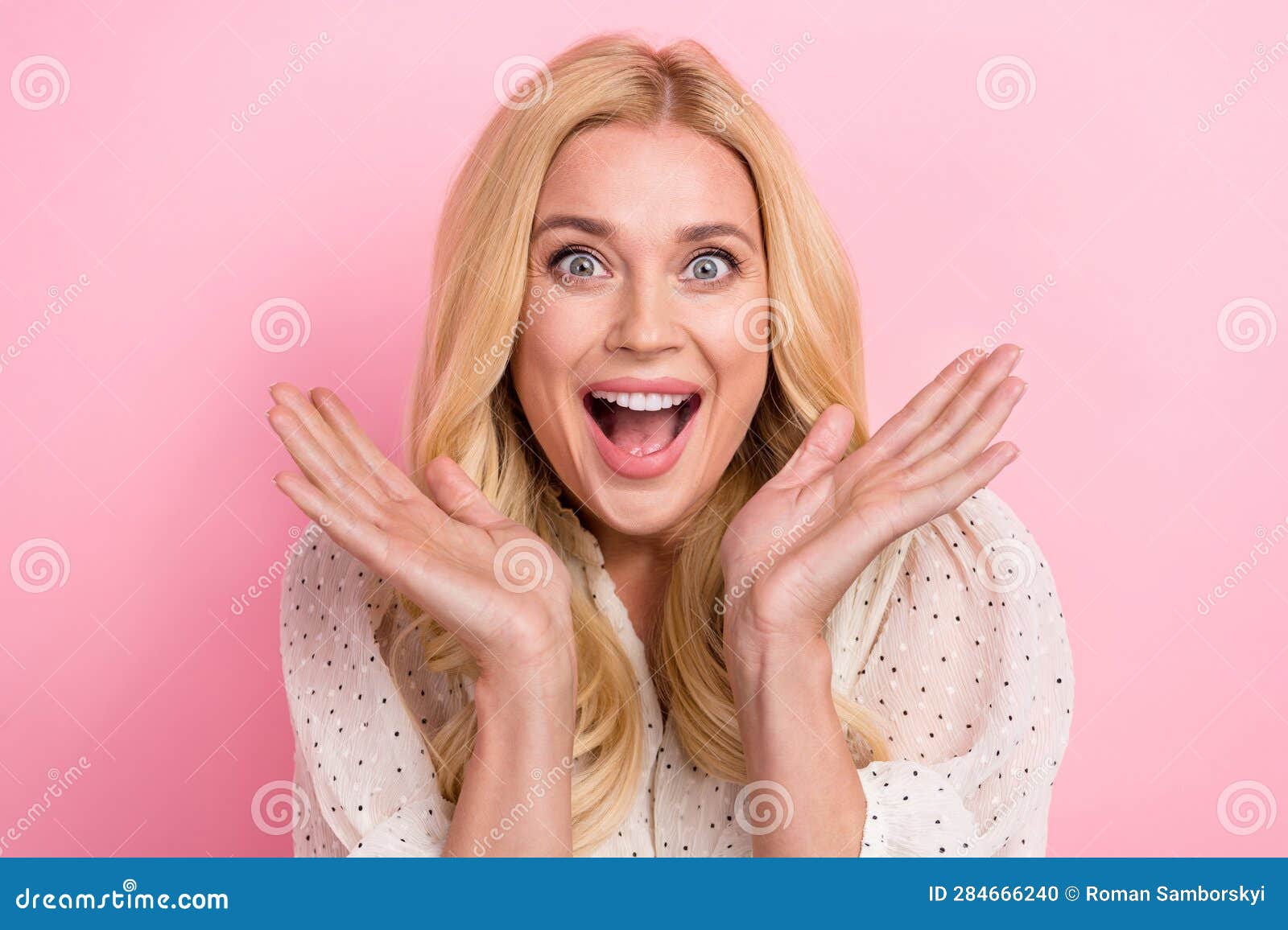 Portrait Of Impressed Overjoyed Woman With Curly Hairdo Wear White