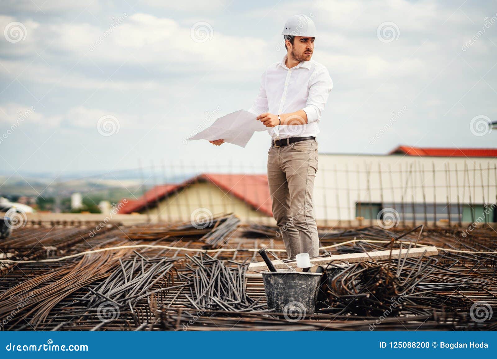 Industry Civil Engineer Reading Blueprints on Construction Site Stock ...
