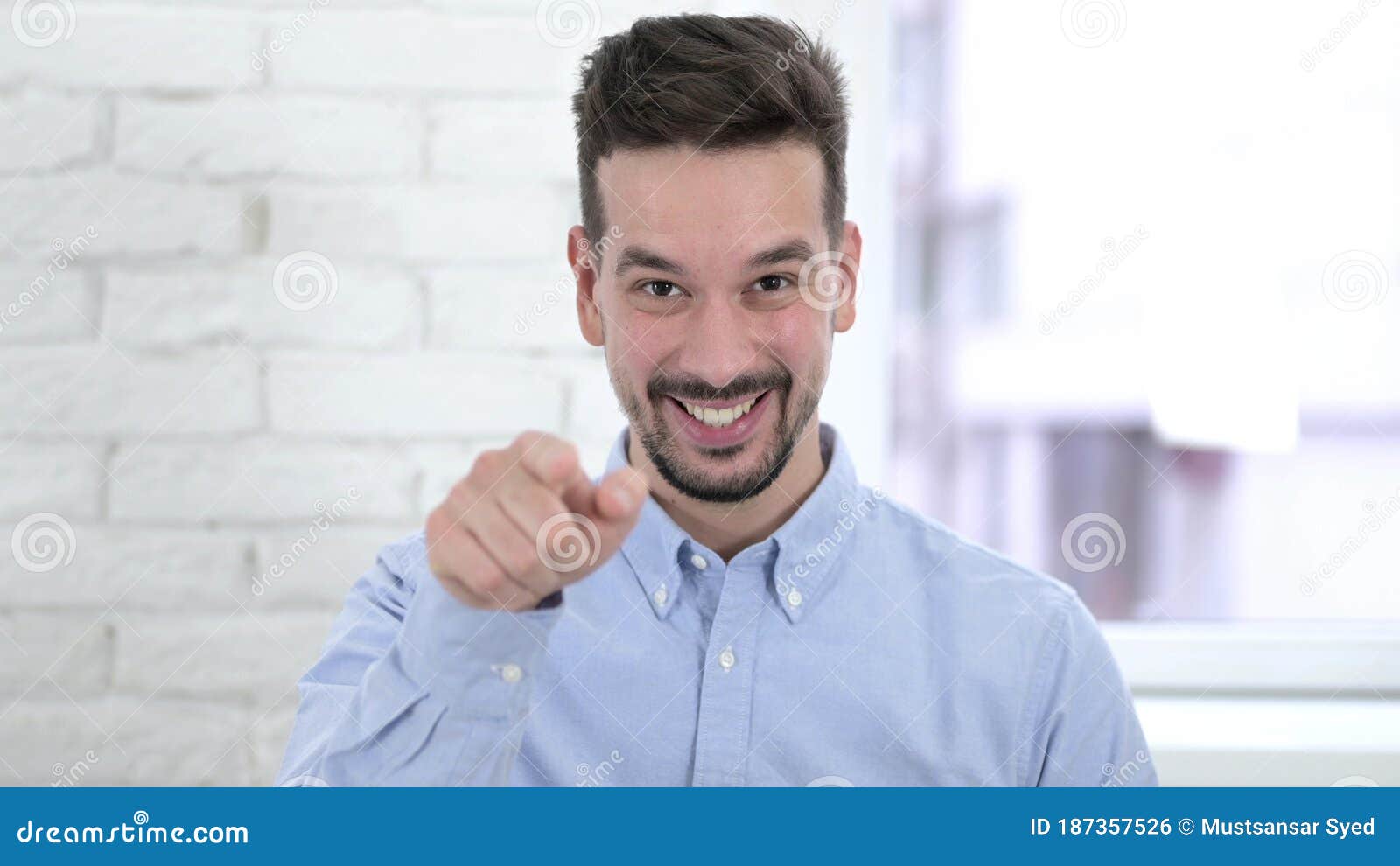 Portrait of Inviting Positive Young Man Stock Photo - Image of loft ...