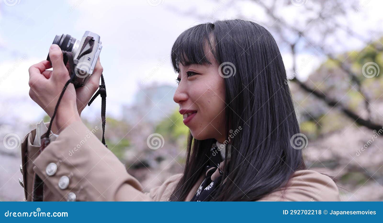 A Portrait Of Japanese Woman Shooting By Mirrorless Camera Behind