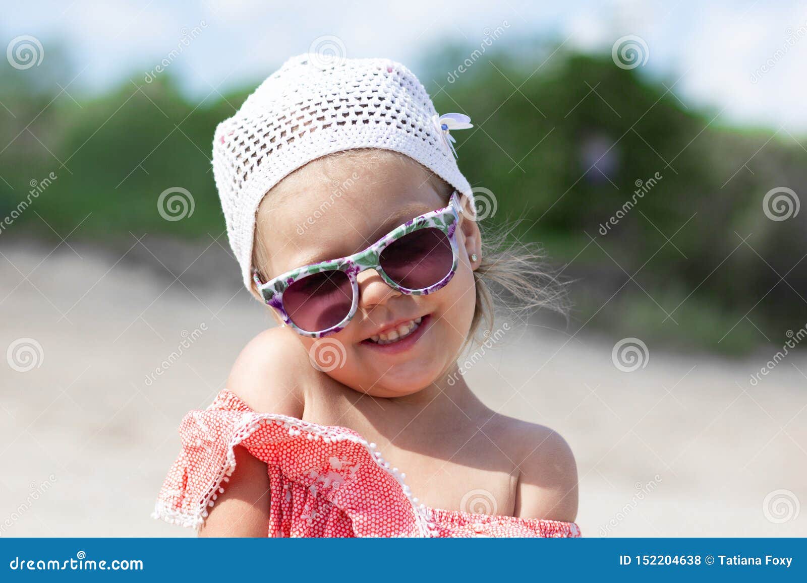 Portrait of Joyful Smiling and Happy Little Girl in Sunglasses Outdoors ... Portrait of Joyful Smiling and Happy Little Girl in Sunglasses Outdoors ...
