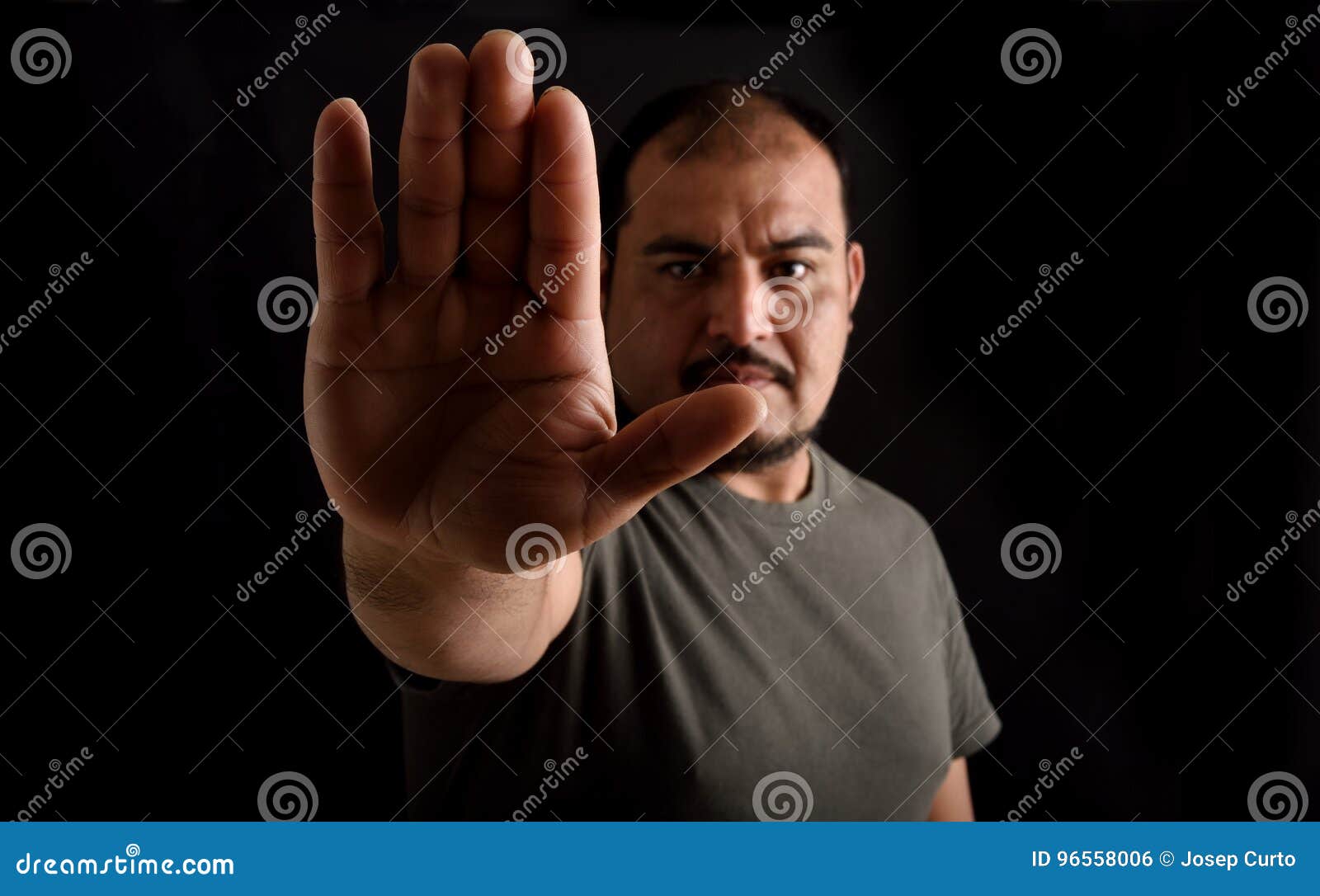 Portrait of a Latin Man with Stop Sing on Black Stock Photo - Image of ...