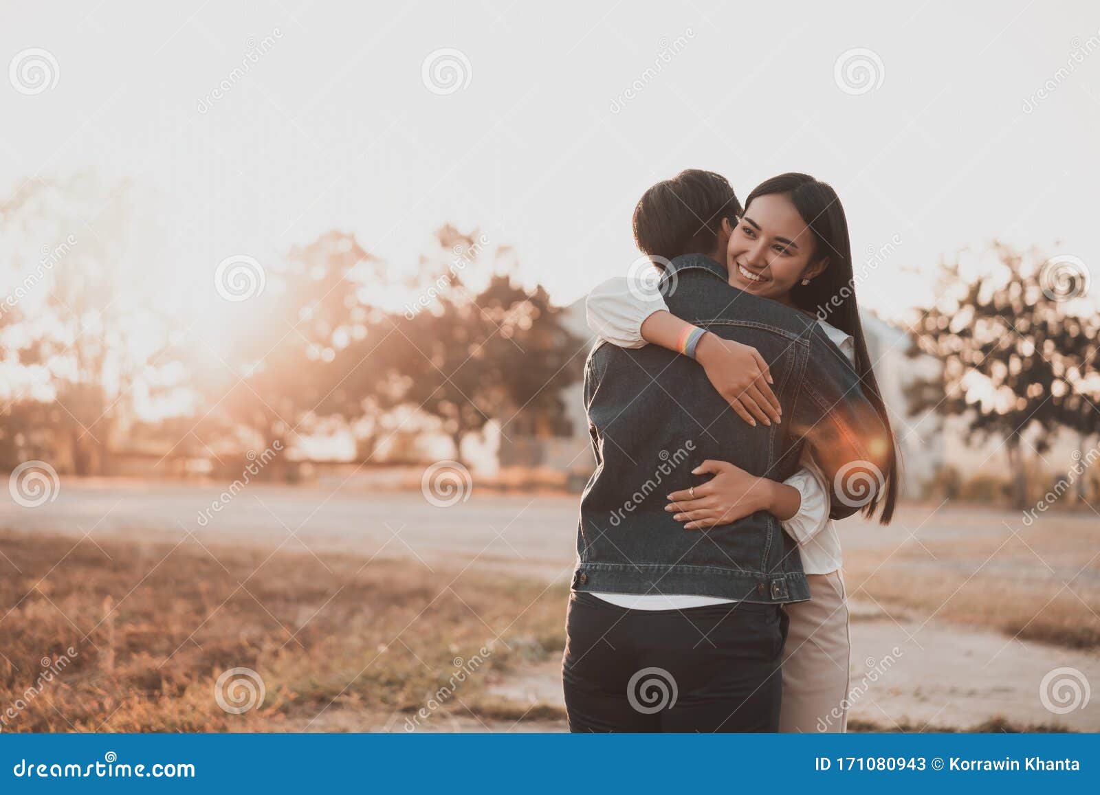 Portrait Of Lesbian Couple Standing And Hugging Having Fun Relaxing At