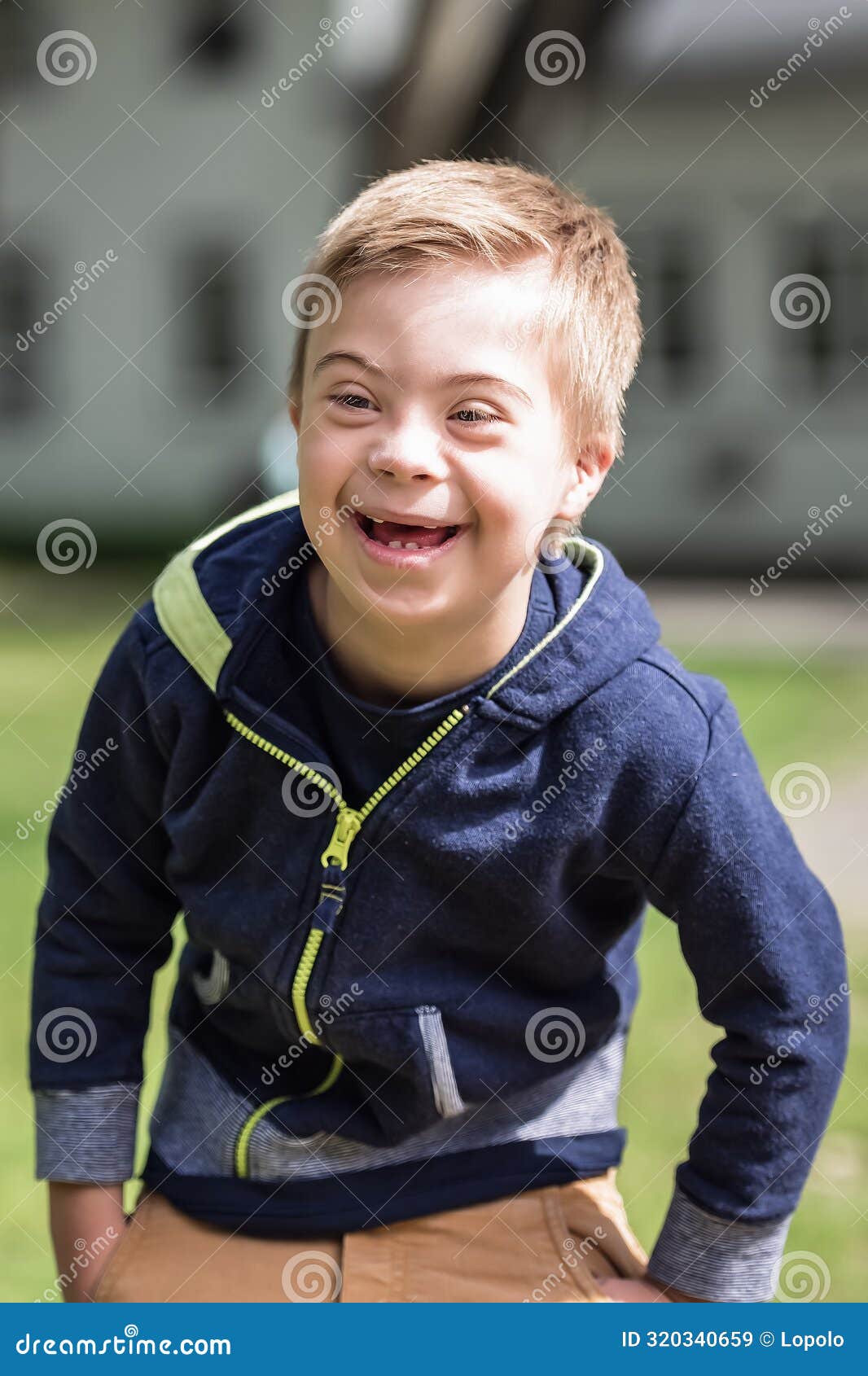 Portrait of a Little Boy with Down Syndrome while Playing in a Park ...