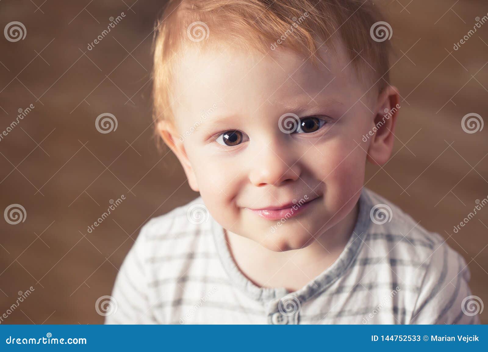 Portrait of Little Boy with Nice Smile Looks into Camera Stock Image ...