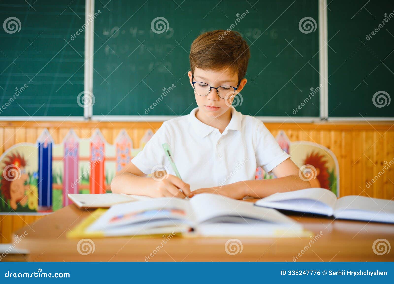 Portrait of Little Boy Studying in Classroom at School Stock Photo ...