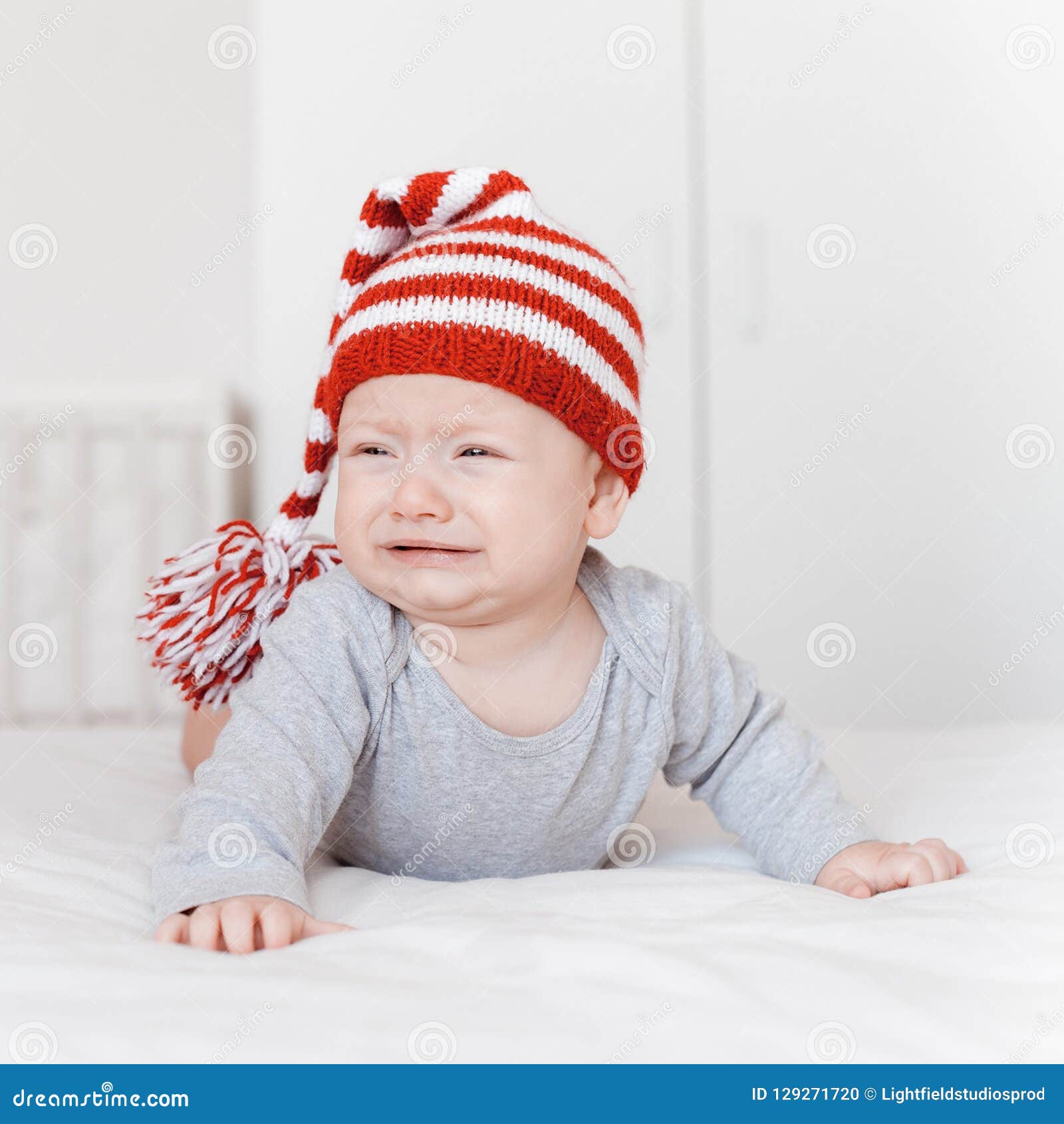 Portrait of Little Crying Infant Child Stock Photo - Image of knitted ... Portrait of Little Crying Infant Child Stock Photo - Image of knitted ...