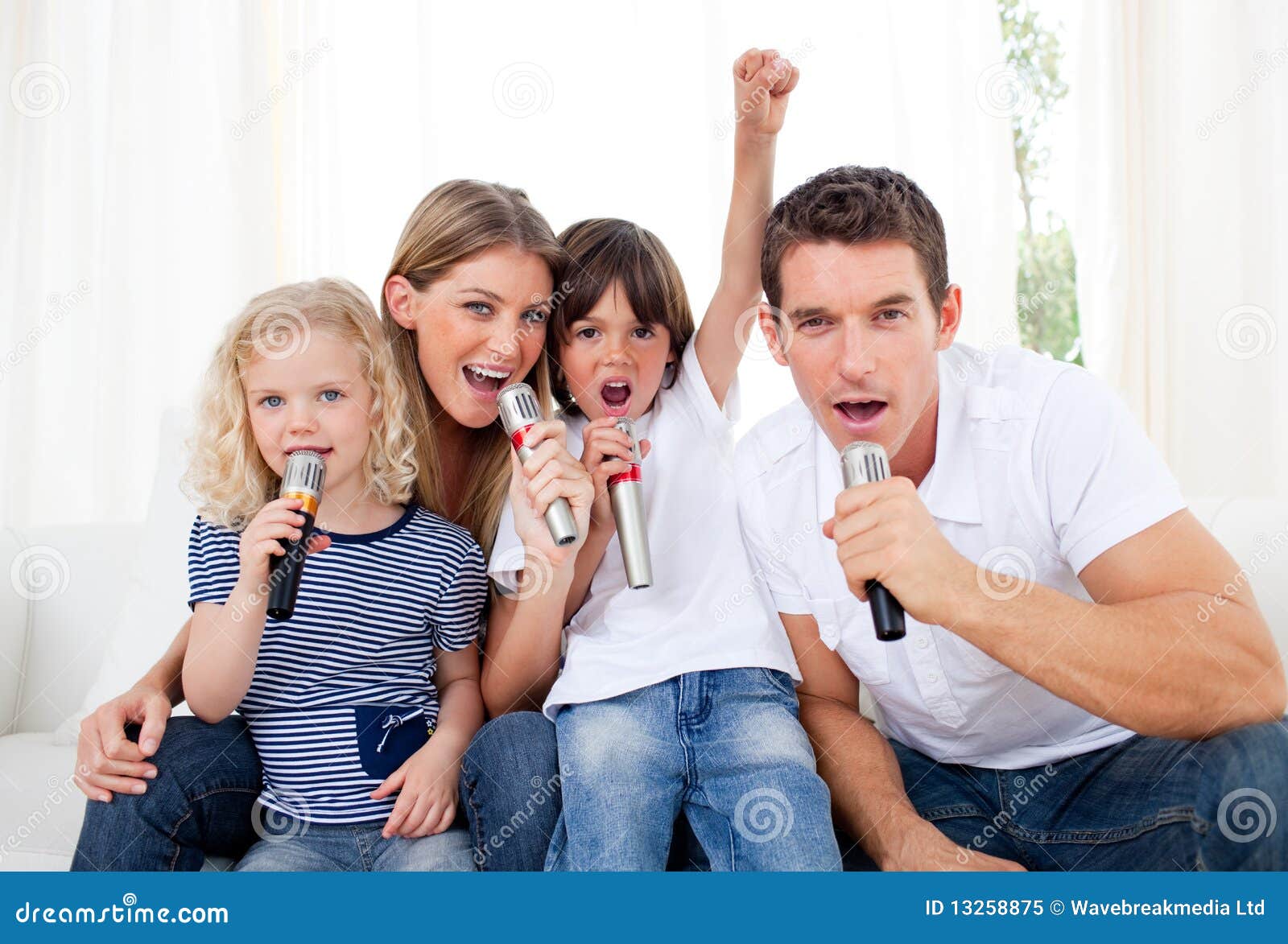 Portrait of a Lively Family Singing Stock Image - Image of brother ...