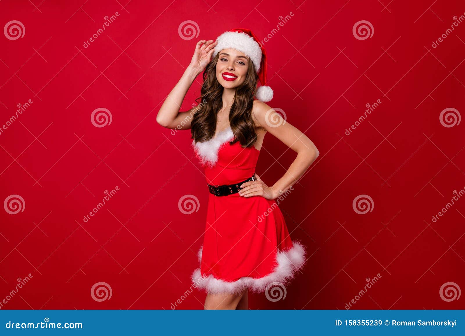 Portrait Of Lovely Woman Adjusting Her Costume Looking With Toothy