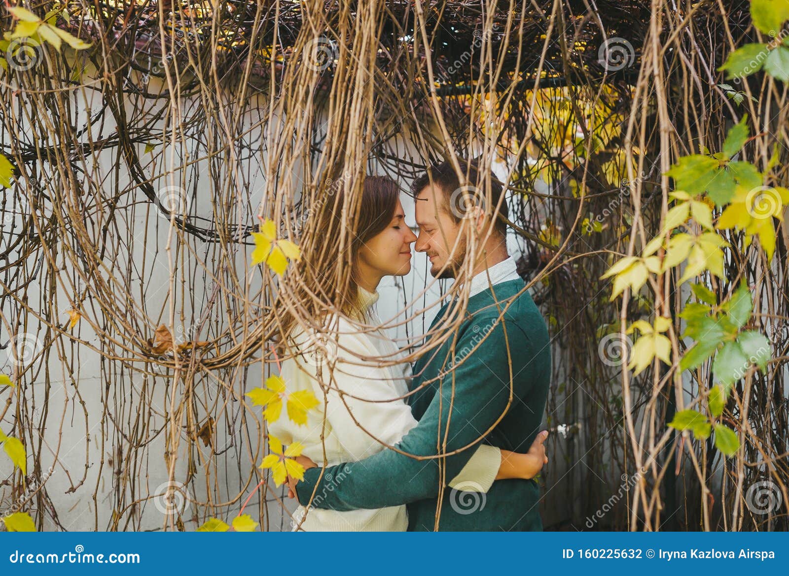 Portrait of a Loving Couple Standing Outside Under the Hanging Branches ...