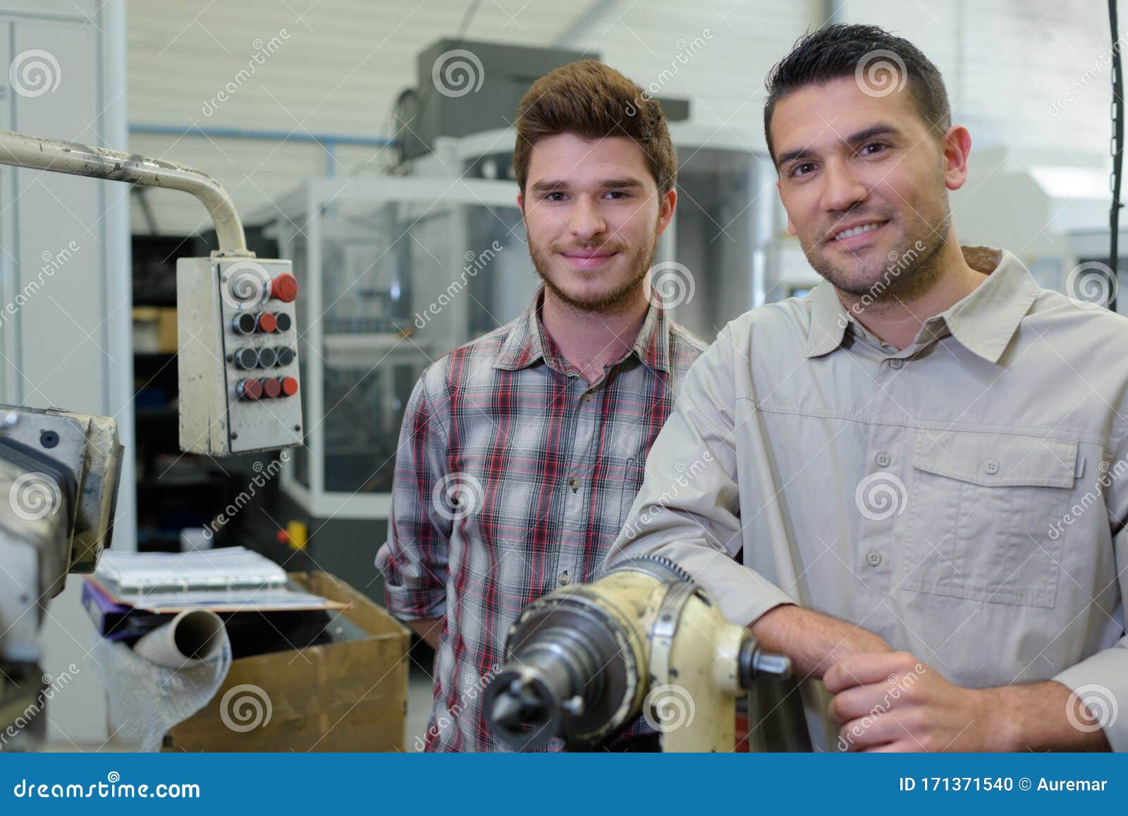 Portrait Of Two Machinists Is Standing With Confident With Safety ...