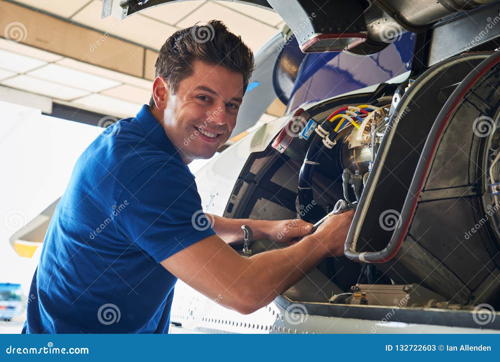 Portrait of Male Aero Engineer Working on Helicopter in Hangar Stock ...