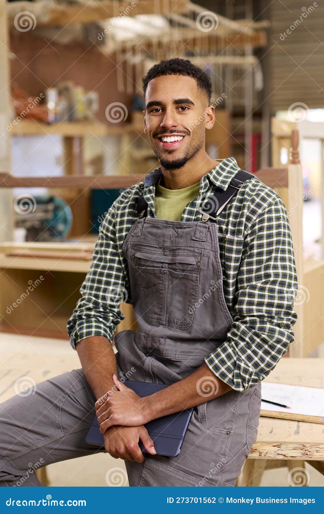 Portrait of Male Apprentice Working As Carpenter in Furniture Workshop ...