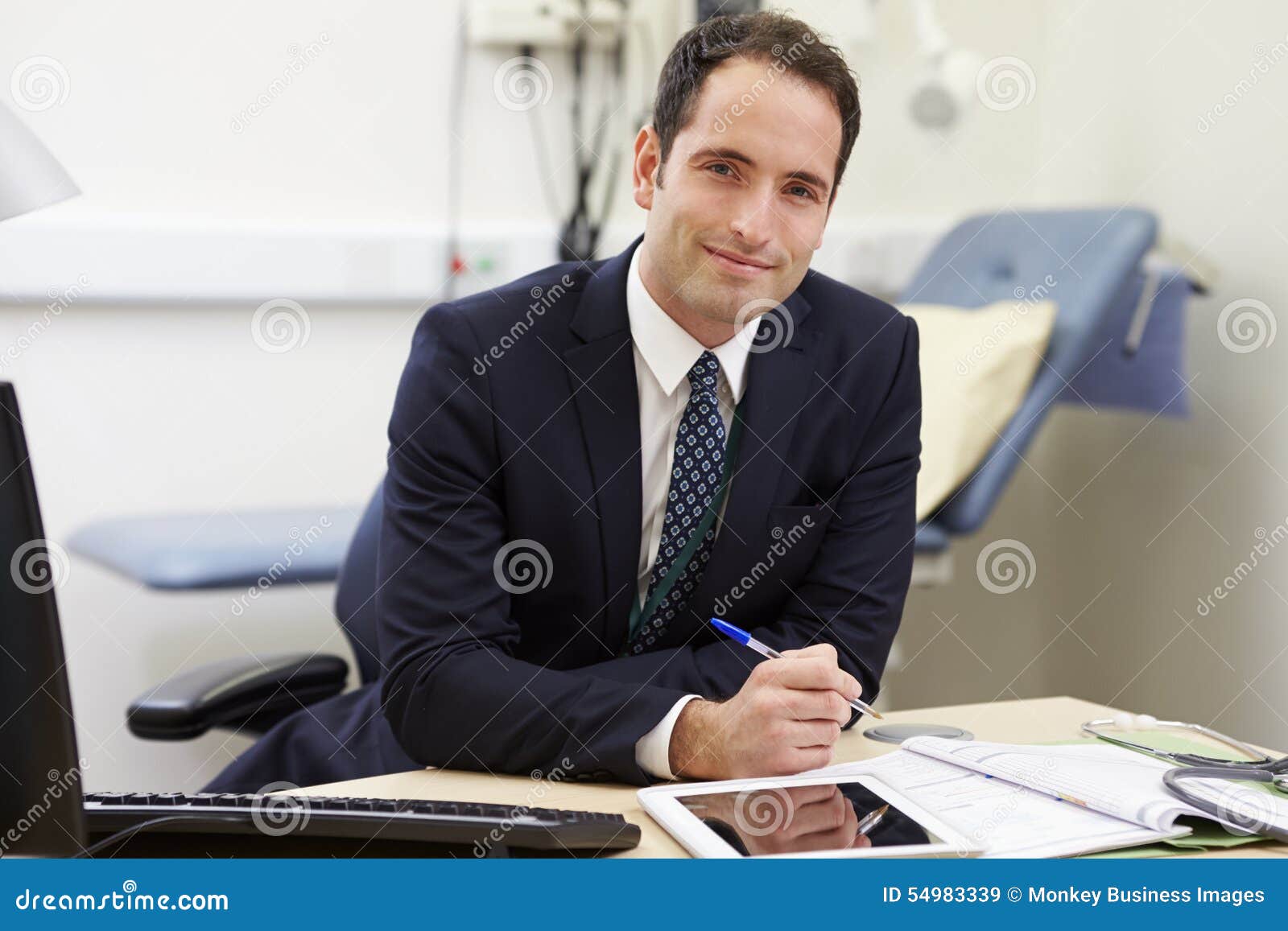 Portrait of Male Consultant Working at Desk in Office Stock Image ...