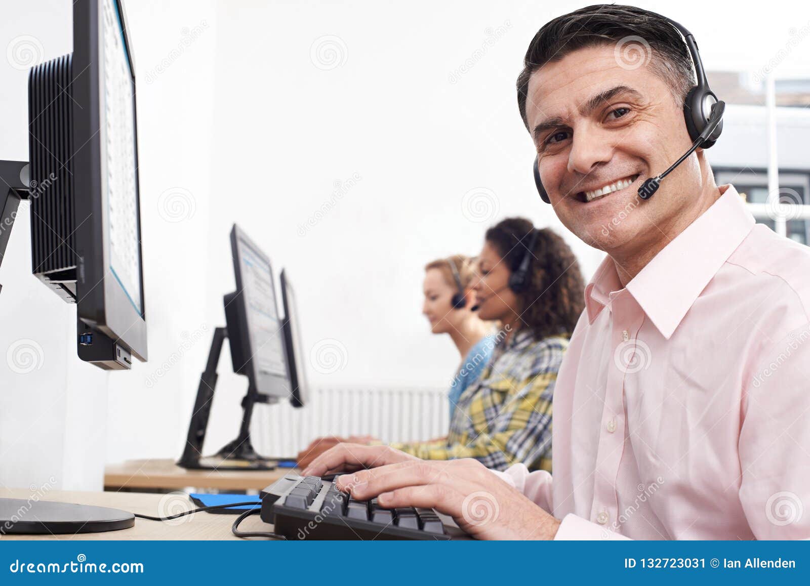 Portrait of Male Customer Services Agent in Call Centre Stock Image ...