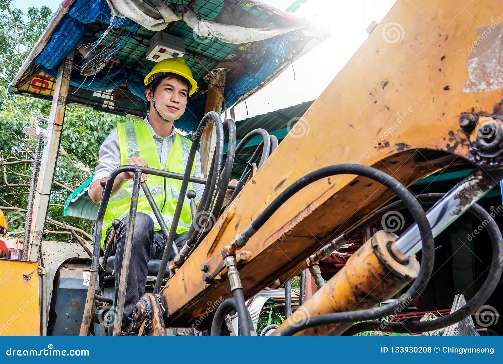 Portrait of a Male Developer Sitting Operator Driving Excavator at ...