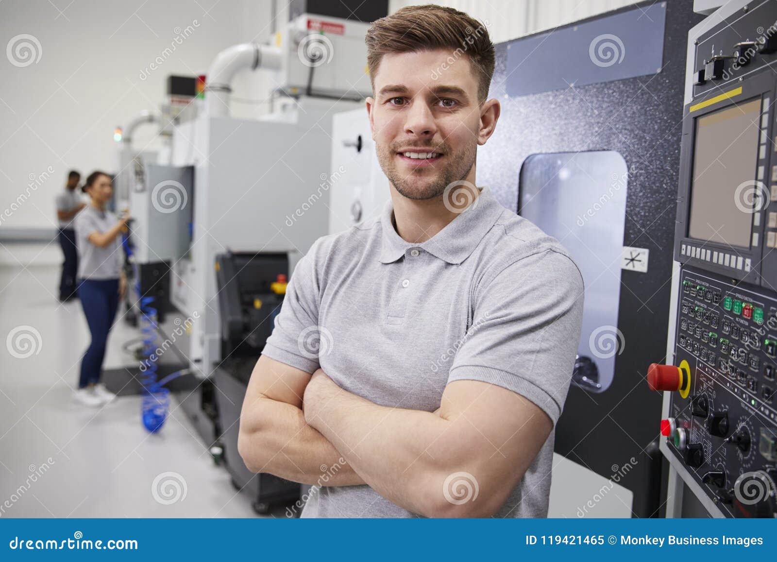 Portrait of Male Engineer Operating CNC Machinery in Factory Stock ... Portrait of Male Engineer Operating CNC Machinery in Factory Stock ...