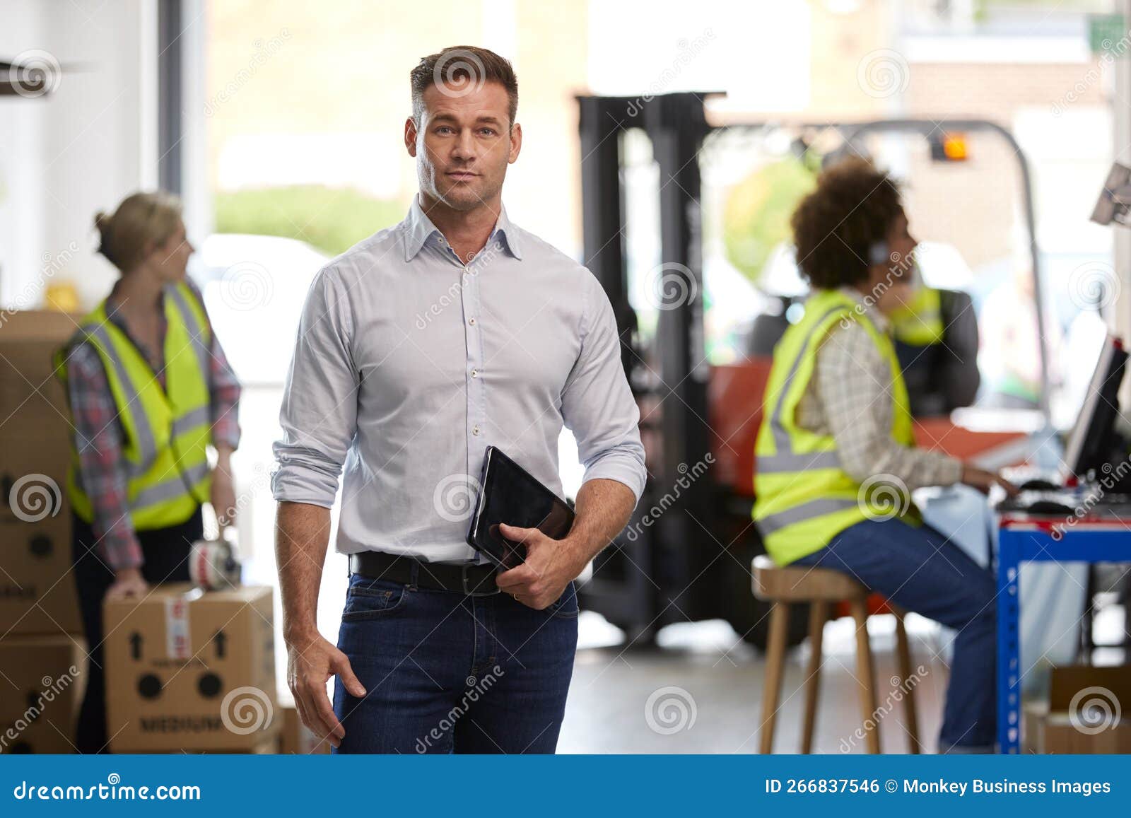 Portrait of Male Manager in Logistics Distribution Warehouse Using ...