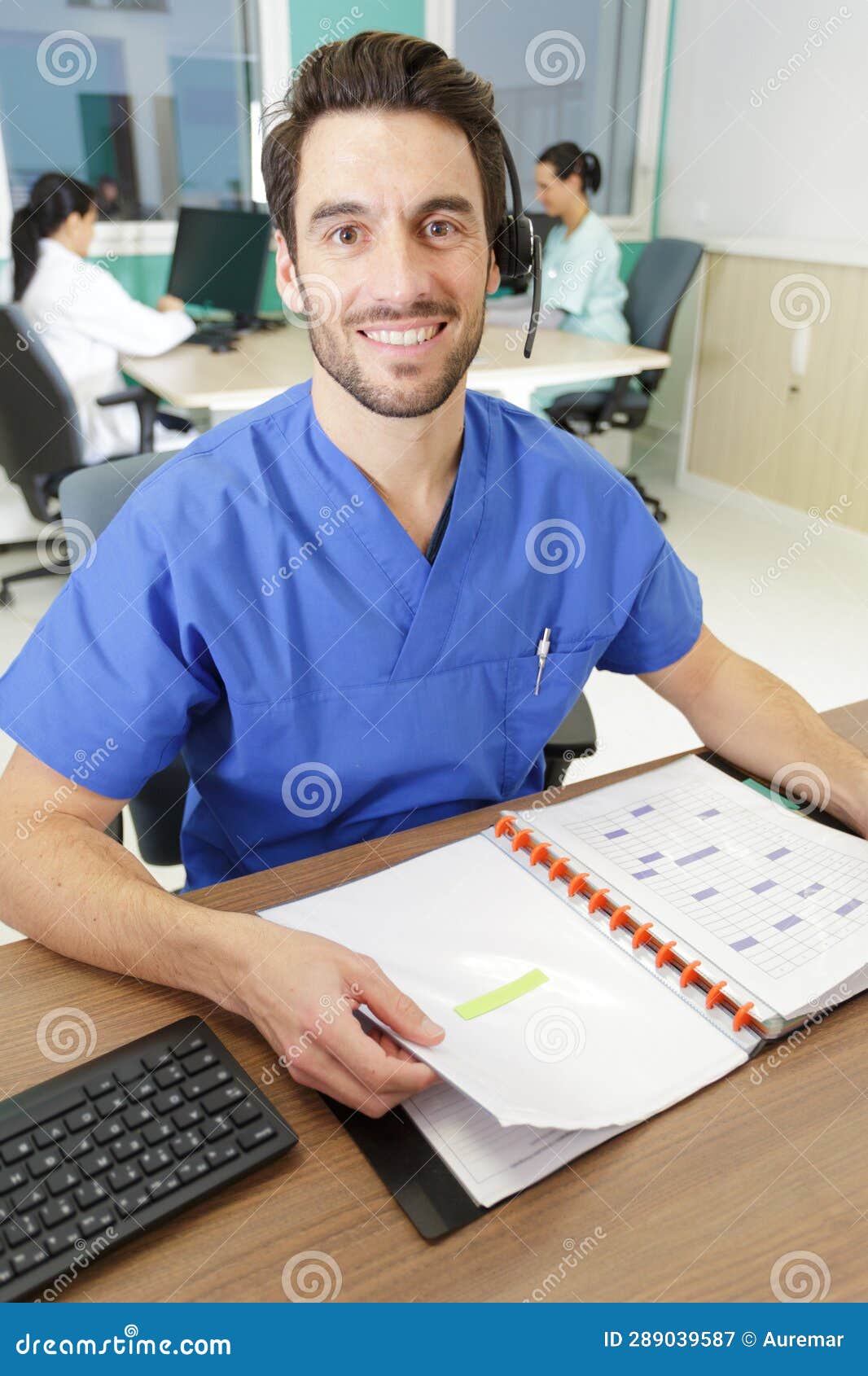 Portrait Male Nurse Working at Nurses Station Stock Image - Image of ...