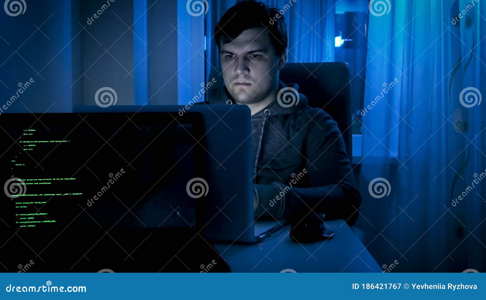 Portrait of Male Programmer or Hacker Working on Computer at Night ... Portrait of Male Programmer or Hacker Working on Computer at Night ...