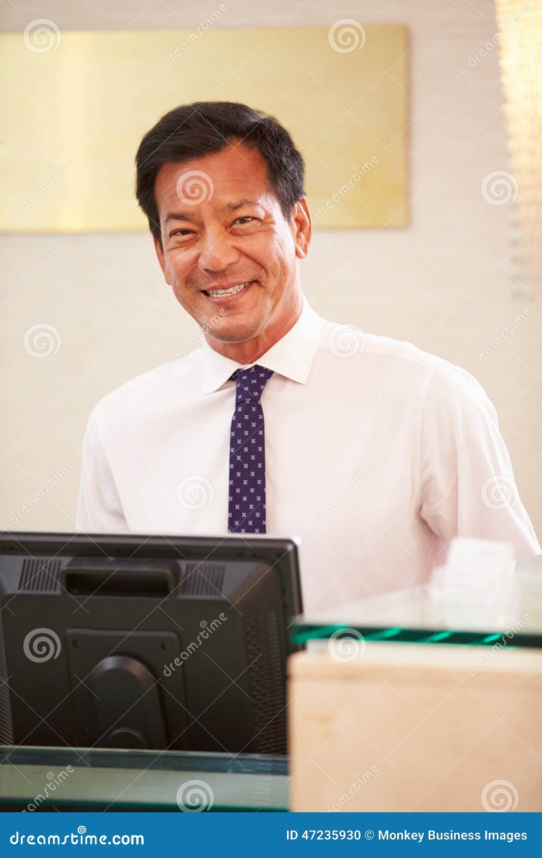 Portrait of Male Receptionist at Hotel Front Desk Stock Photo - Image ...