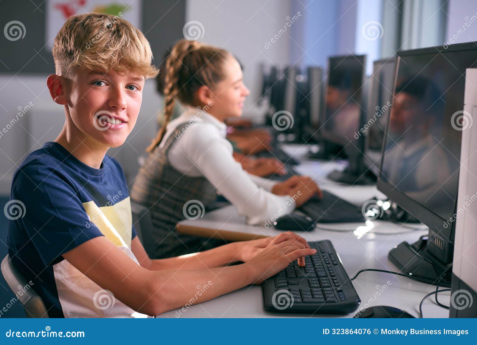 Portrait of Male Secondary or High School Student Sitting at Computer ...
