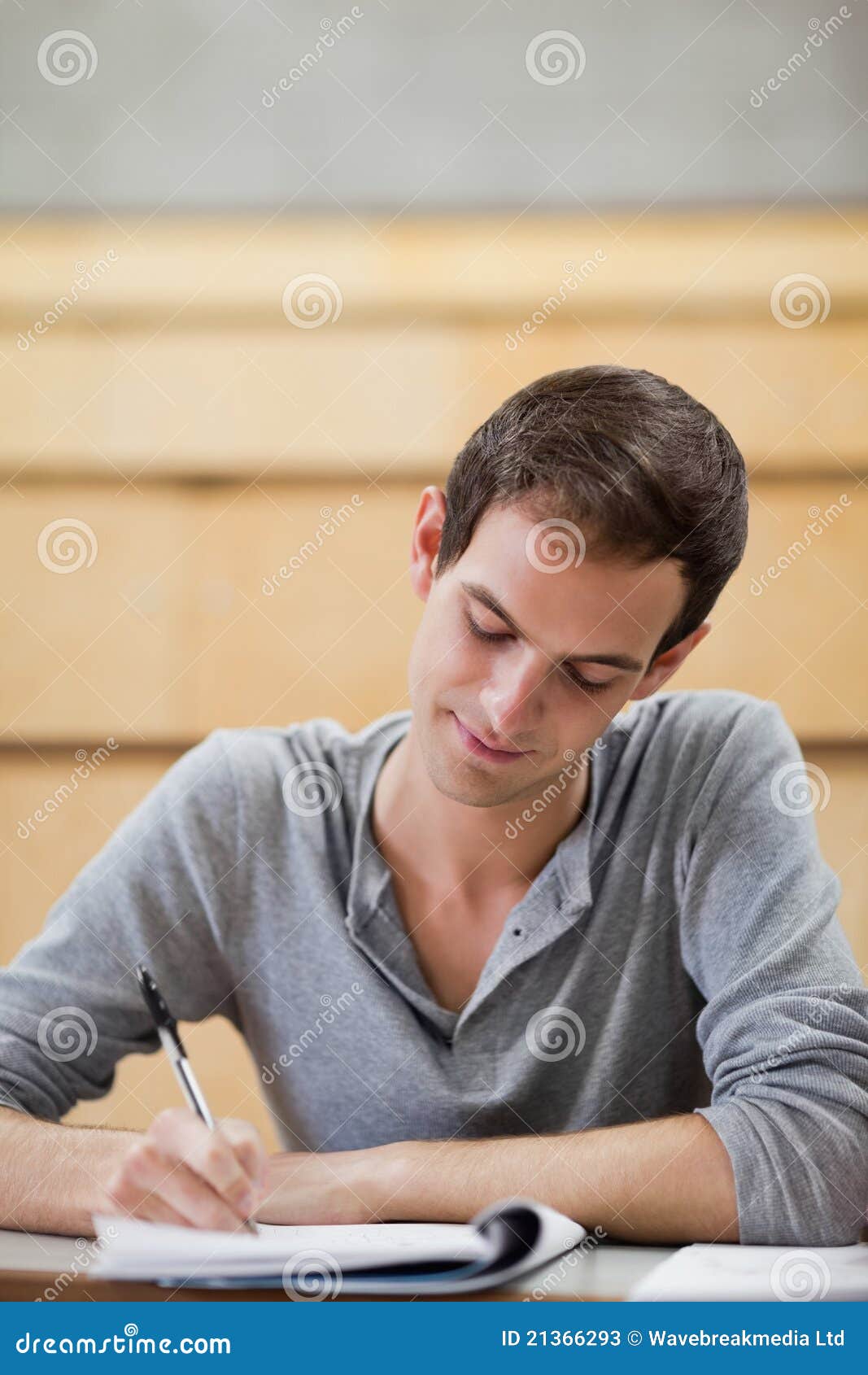 Portrait of a Male Student Writing on a Notepad Stock Image - Image of ...