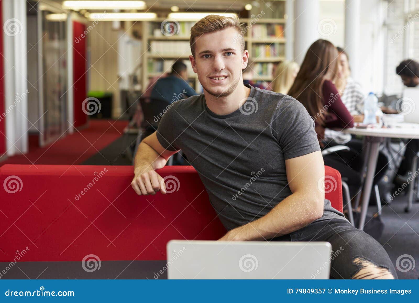 Portrait of Male University Student Working in Library Stock Image ...